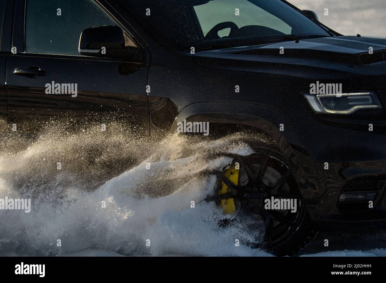 extreme driving, the car is moving rapidly over the smooth snow and ...