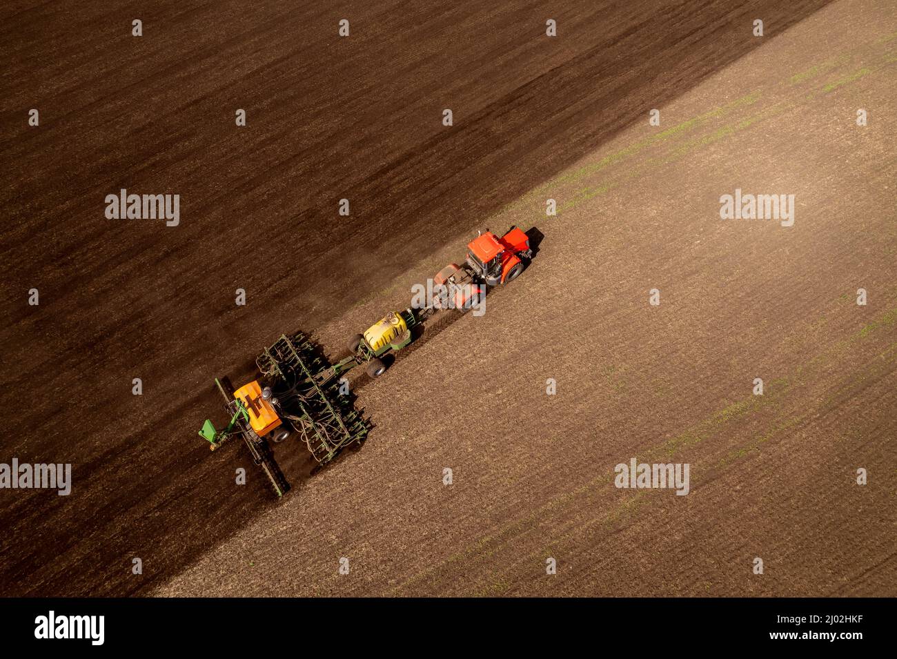Arable agriculture concept, Aerial top view rural. Farmer on tractor ...