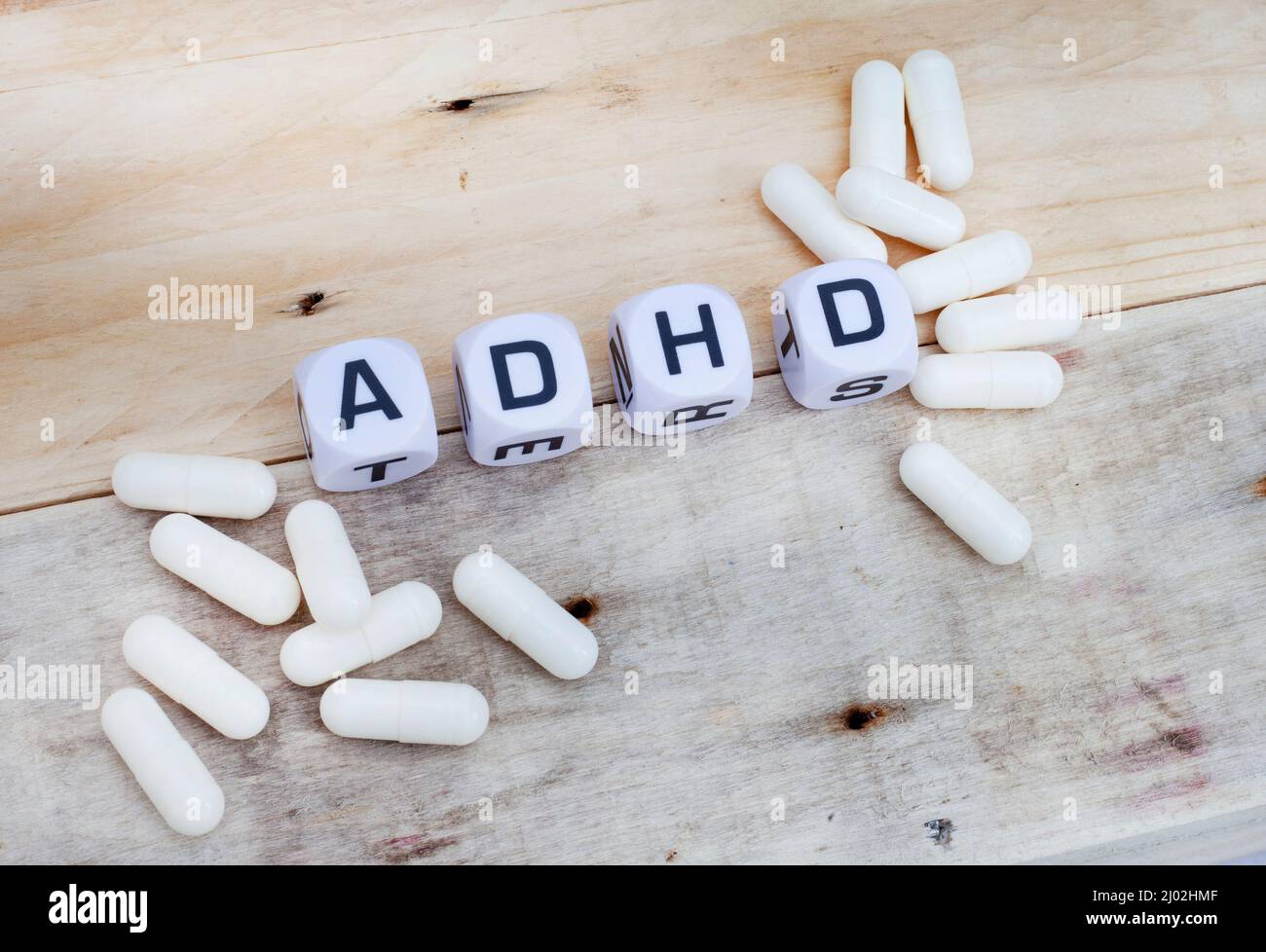 ADHD in letter dice on a rustic and natural wood with copy space ADHD ...