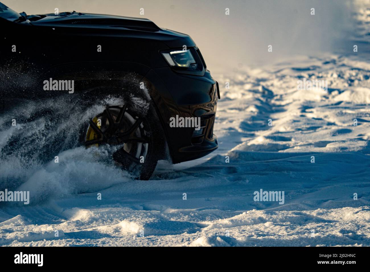 extreme driving, the car is moving rapidly over the smooth snow and ...