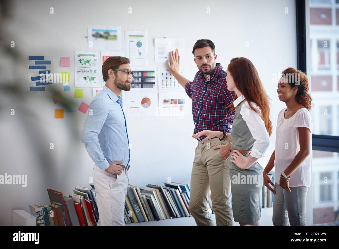 The team that works together wins together. Shot of a group of ...