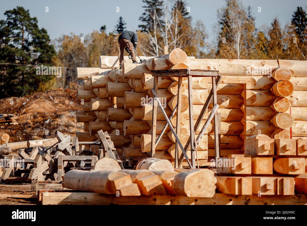 Timber building house construction circle log with blue sky sun light ...