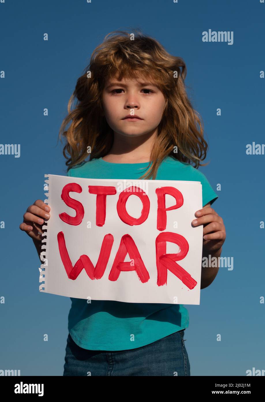 Protest against war. Portrait Blond little boy calls to Stop war ...