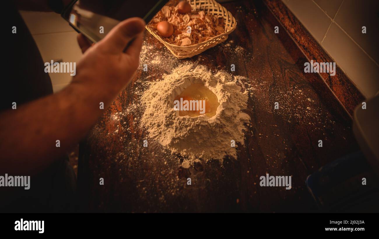 Professional chef checking the ingredients and using his hands for ...