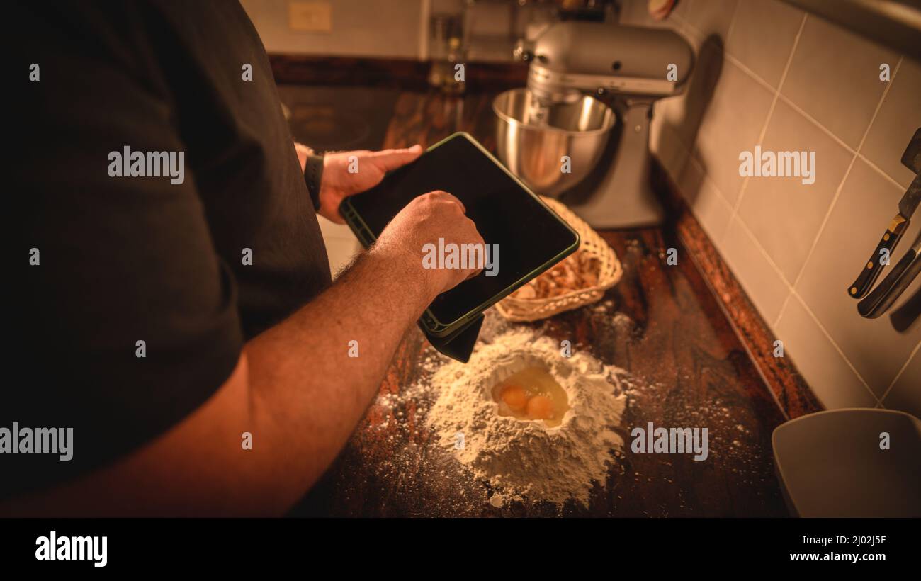 Professional chef checking the ingredients and using his hands for ...