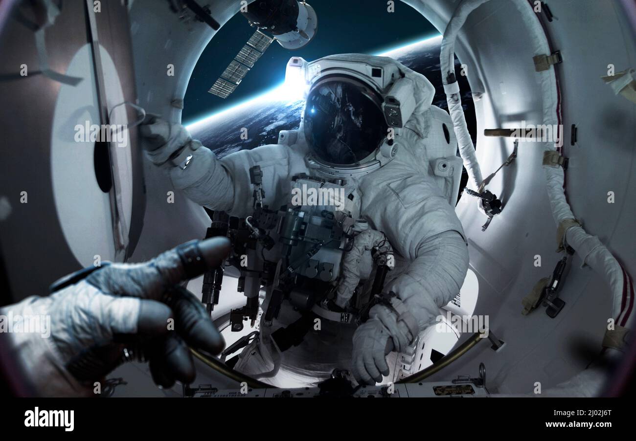 Astronaut at the international space station orbiting Earth planet ...