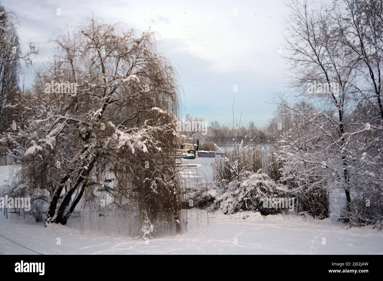 A beautiful and unusual winter landscape, a small Ukrainian boat ...
