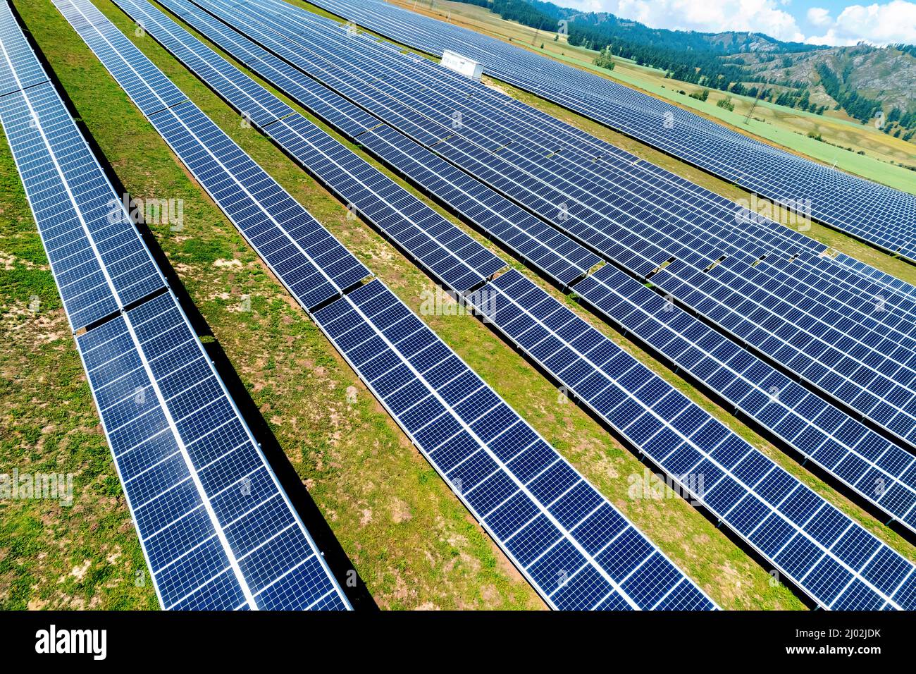 Solar panel, photovoltaic among mountains and hills Aerial view drone ...