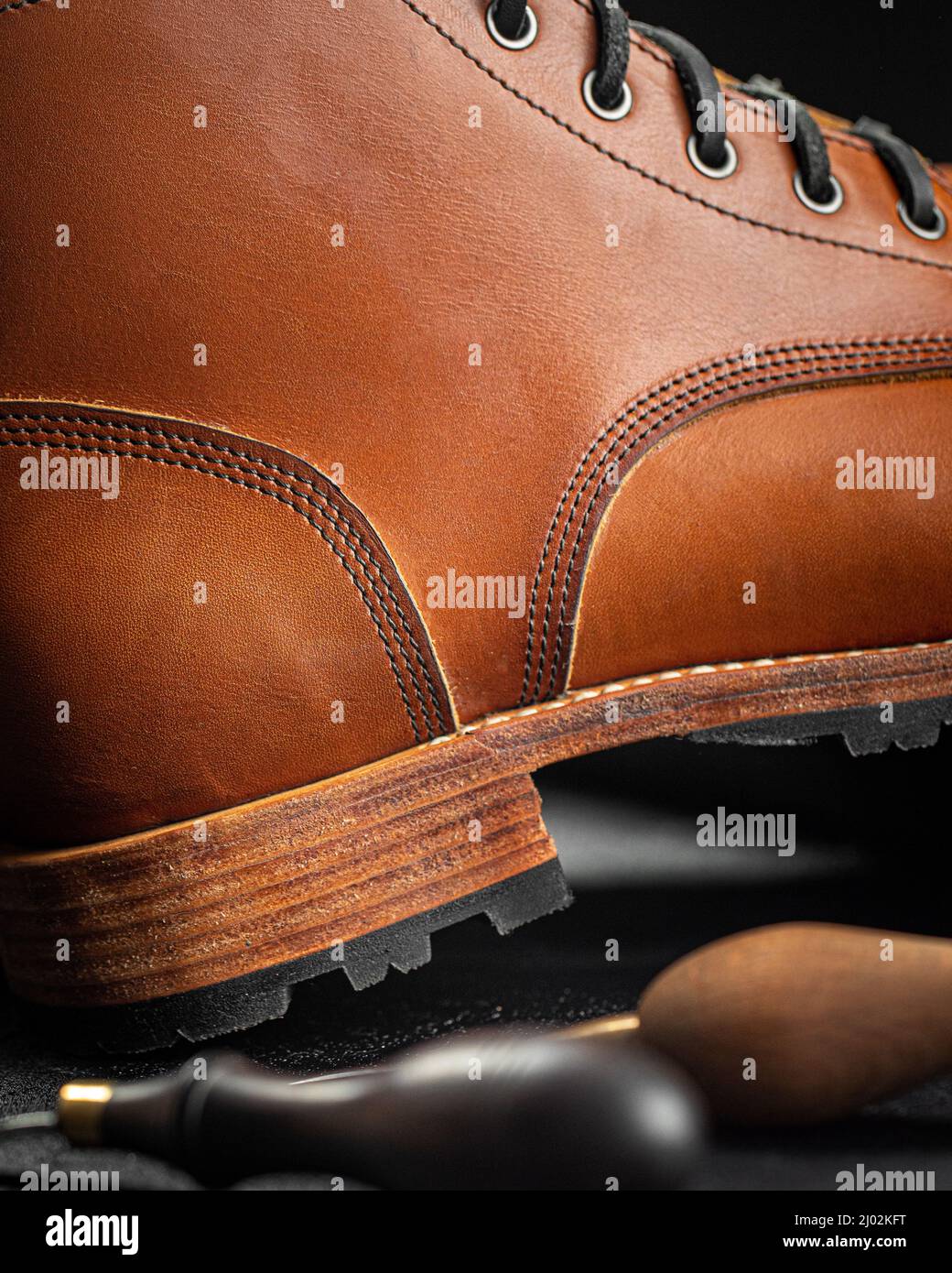 Closeup on handcrafted brown leather boots details Stock Photo - Alamy
