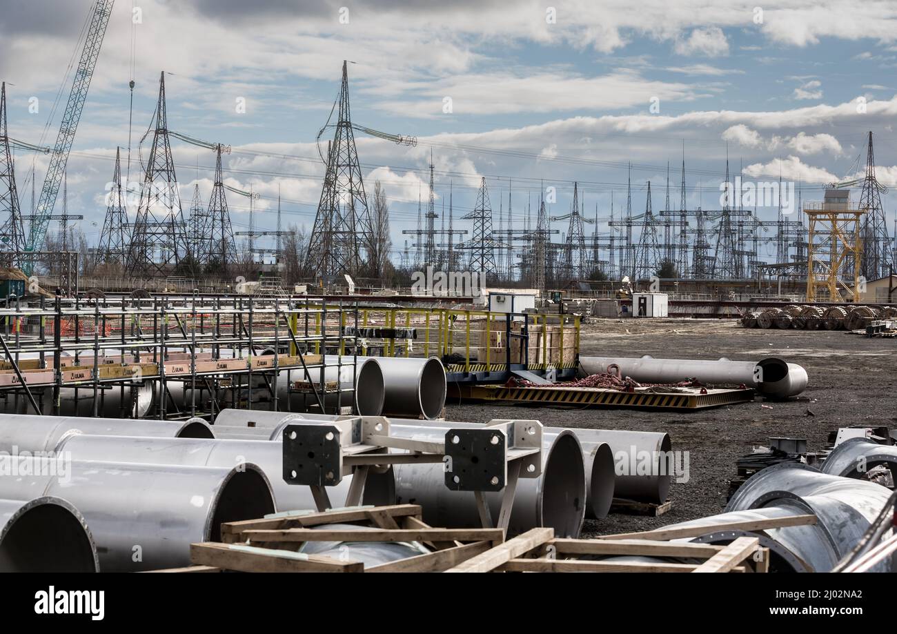 Transformer substations and high-voltage power lines are seen at ...
