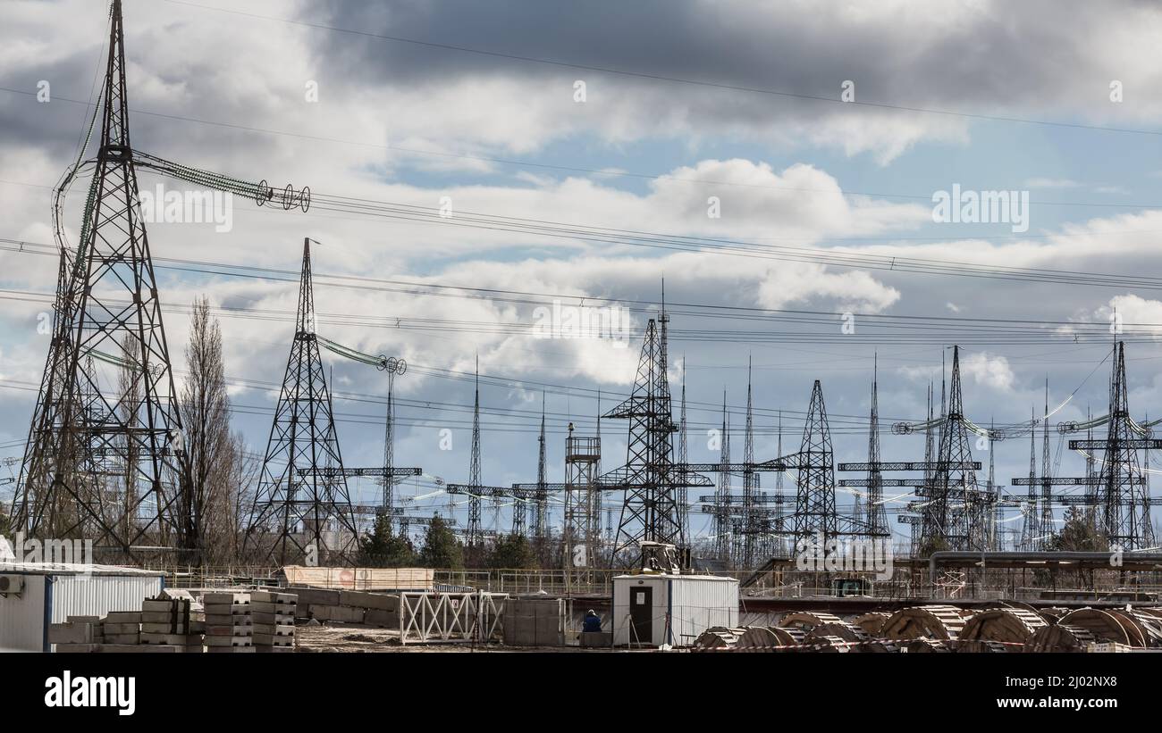 Transformer substations and high-voltage power lines are seen at ...