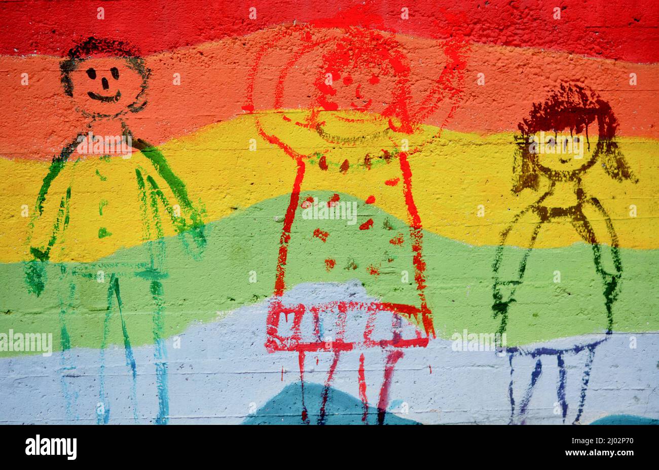 a family and a rainbow with the colors of happiness Stock Photo - Alamy