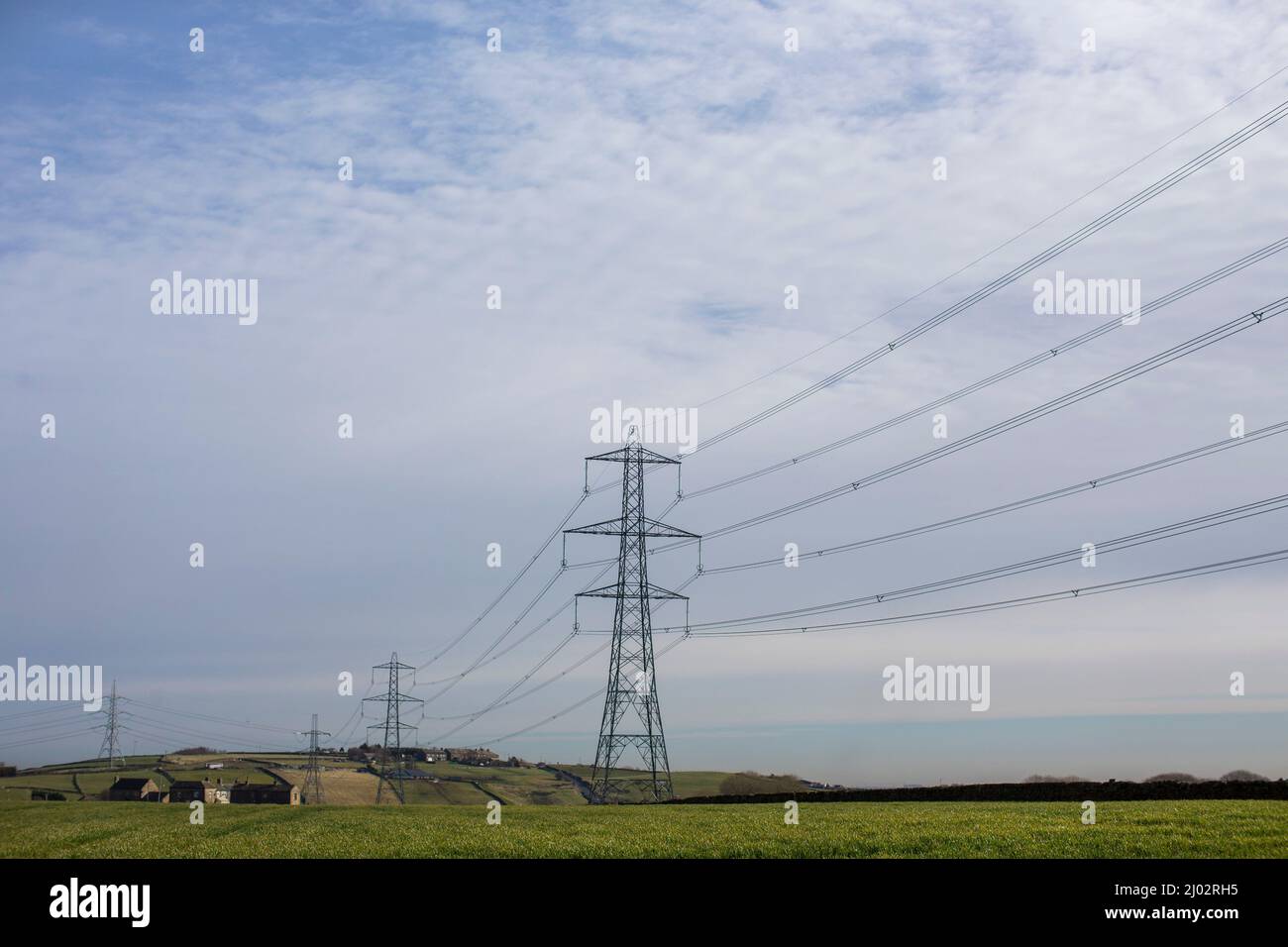 Pylons cross the Pennine landscape near Thornton, Bradford, West ...