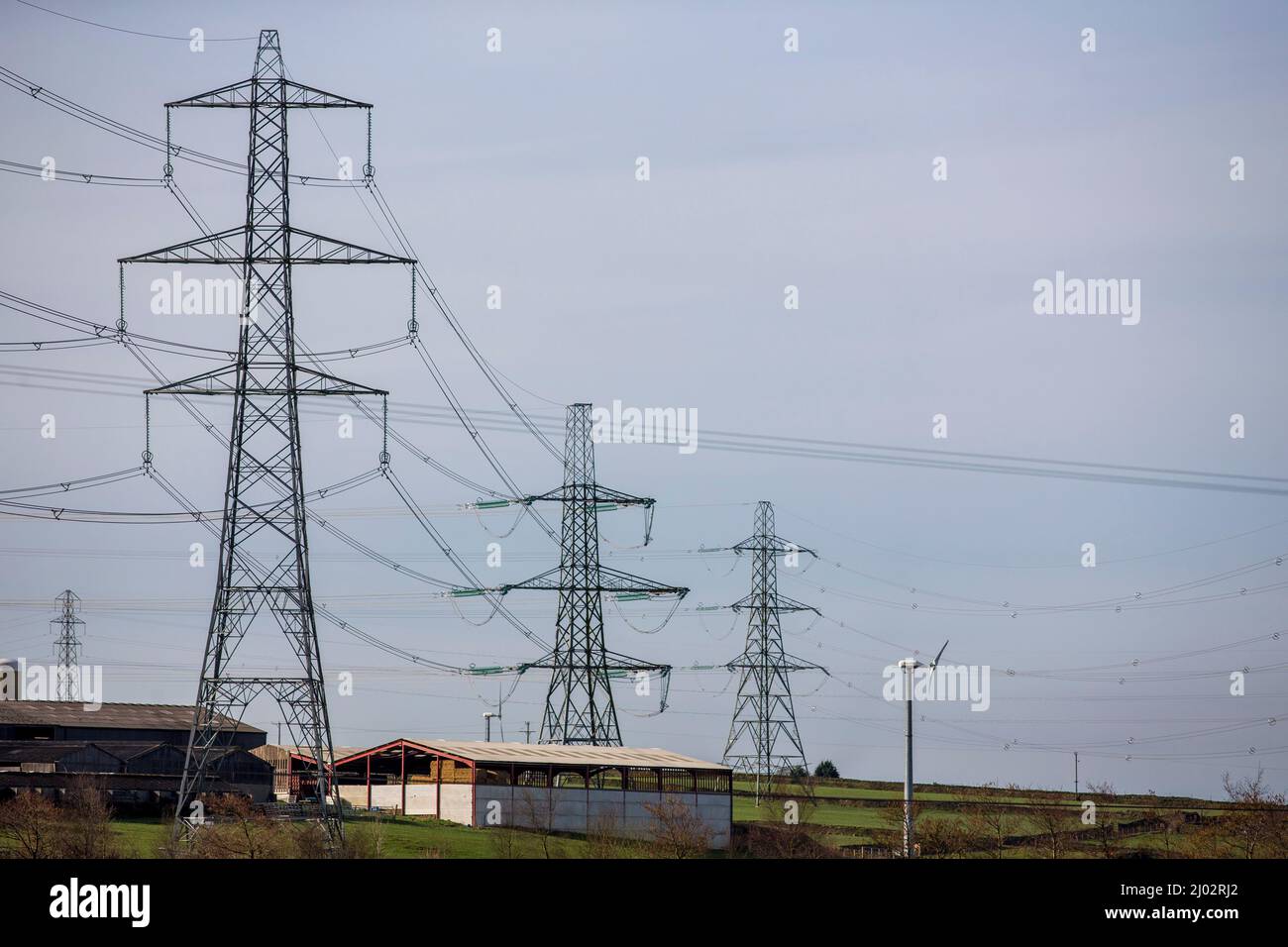 Pylons cross the Pennine landscape near Thornton, Bradford, West ...