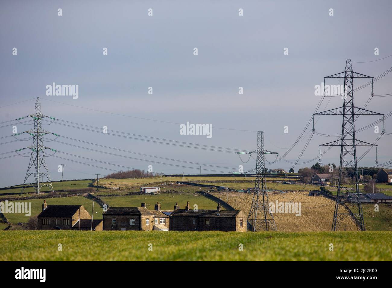 Pylons cross the Pennine landscape near Thornton, Bradford, West ...