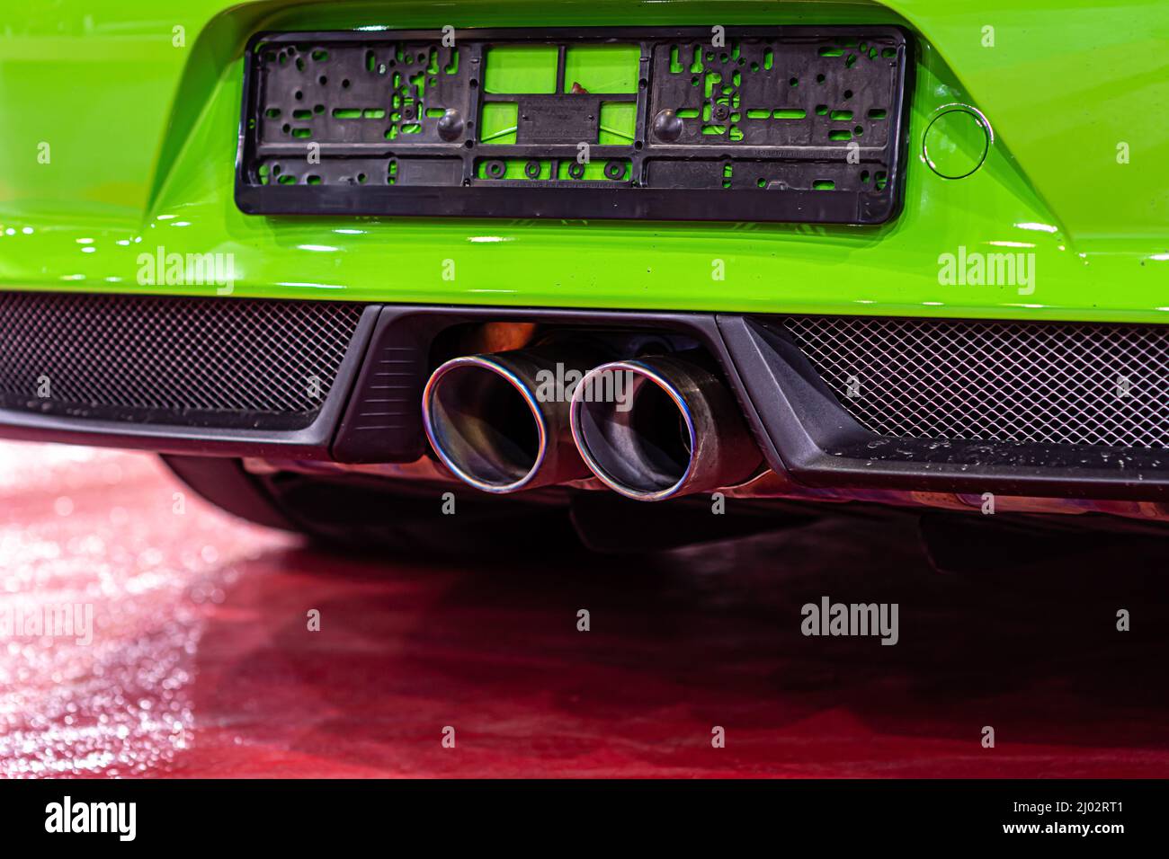 close-up of modern luxury car dual exhaust pipes, vehicle smog ...