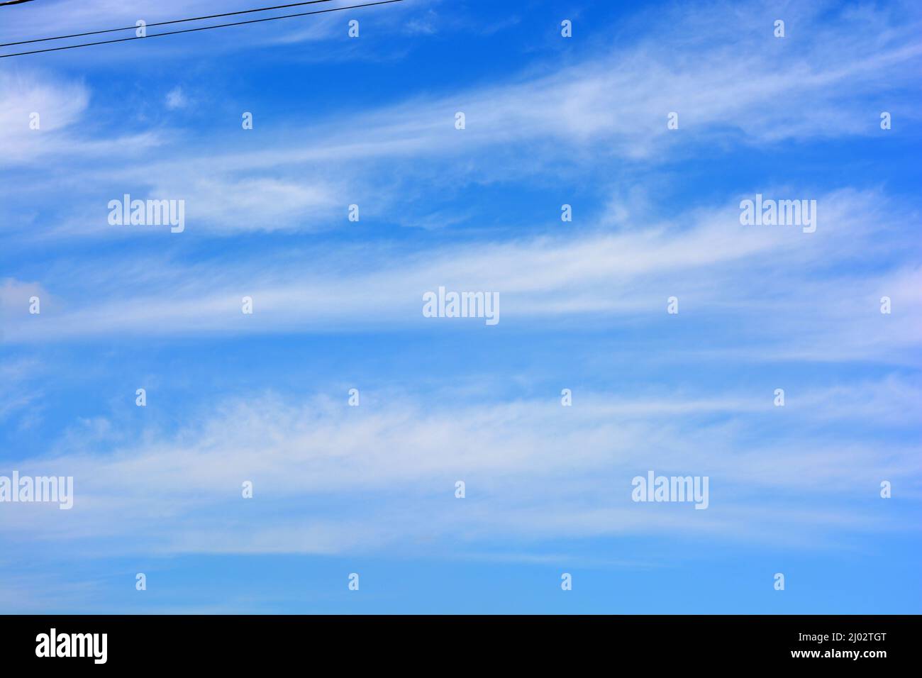 Beautiful and unusual nature, bright light blue sky with small white ...