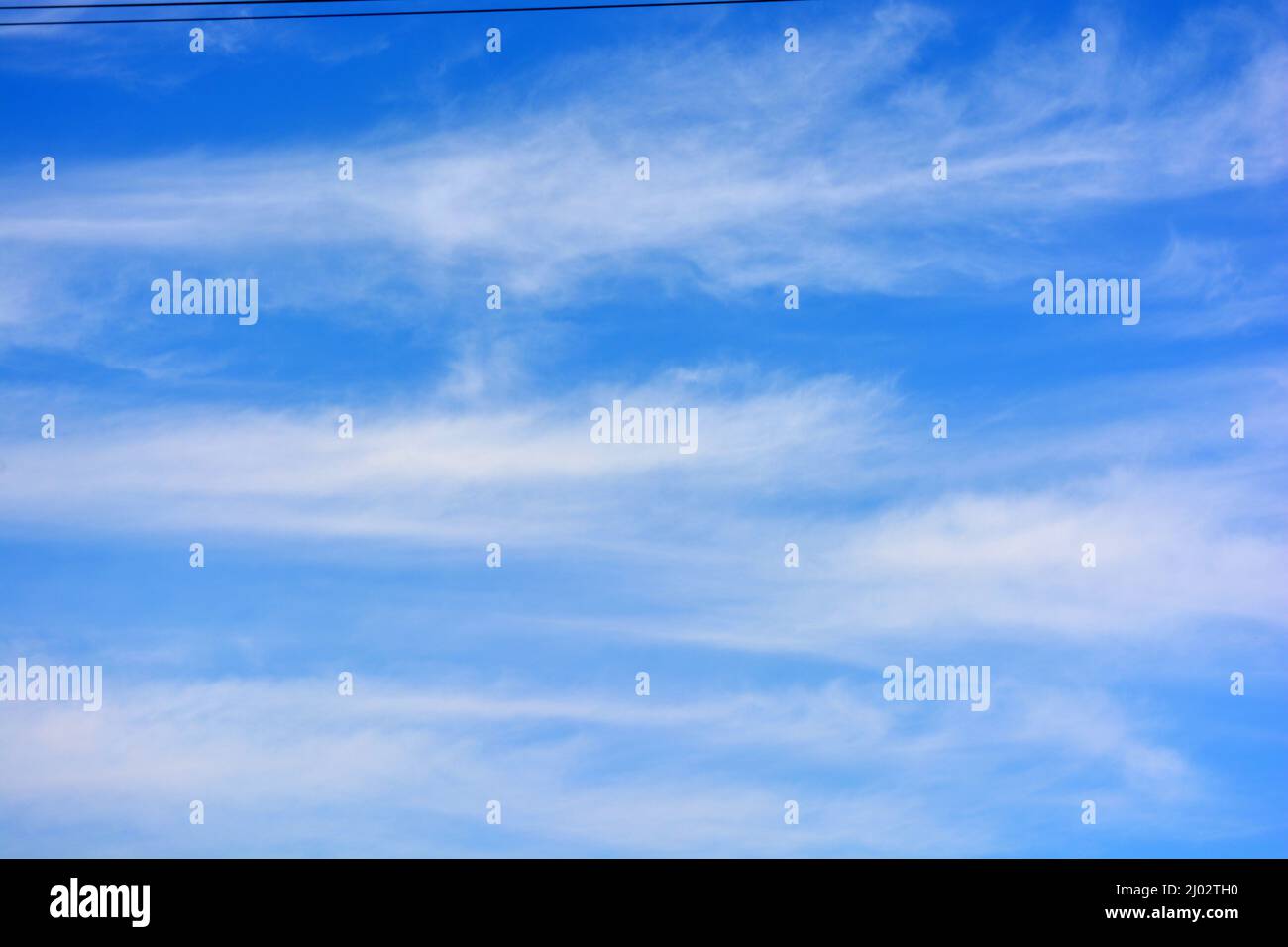 Beautiful and unusual nature, bright light blue sky with small white ...