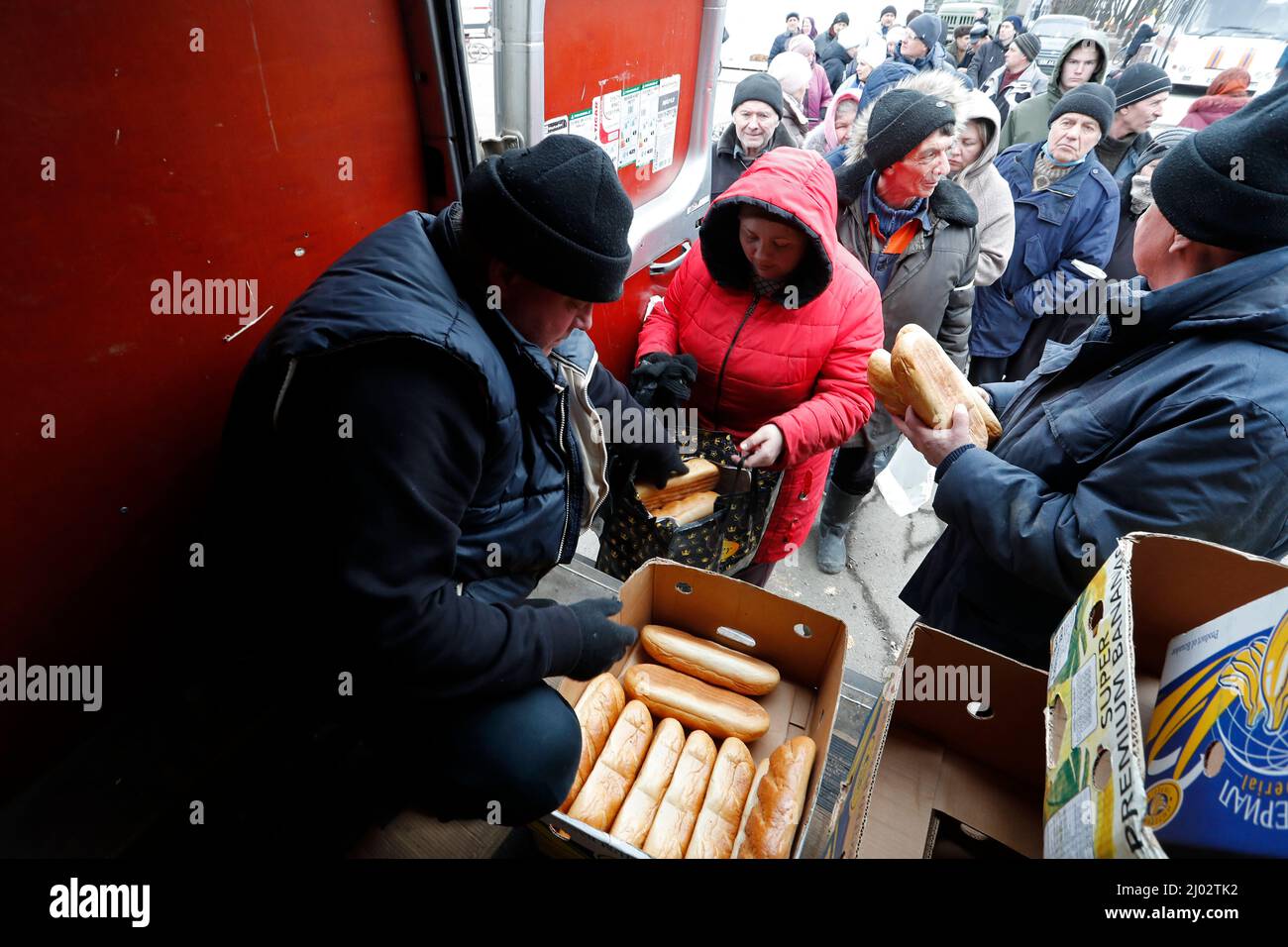 Donetsk. 15th Mar, 2022. Local residents queue up to receive ...