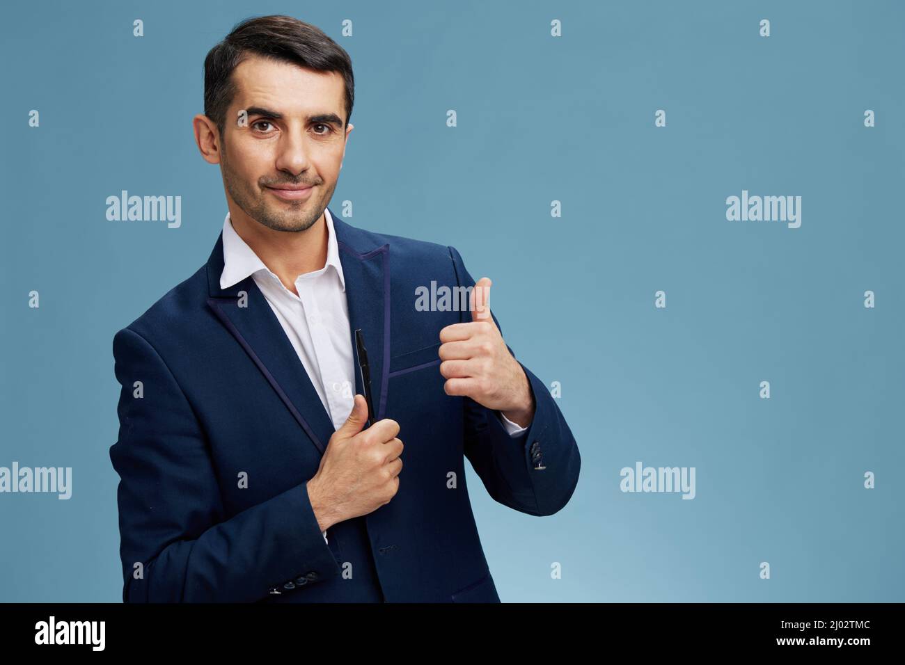 businessman portrait blue suit thumbs up success emotions isolated ...