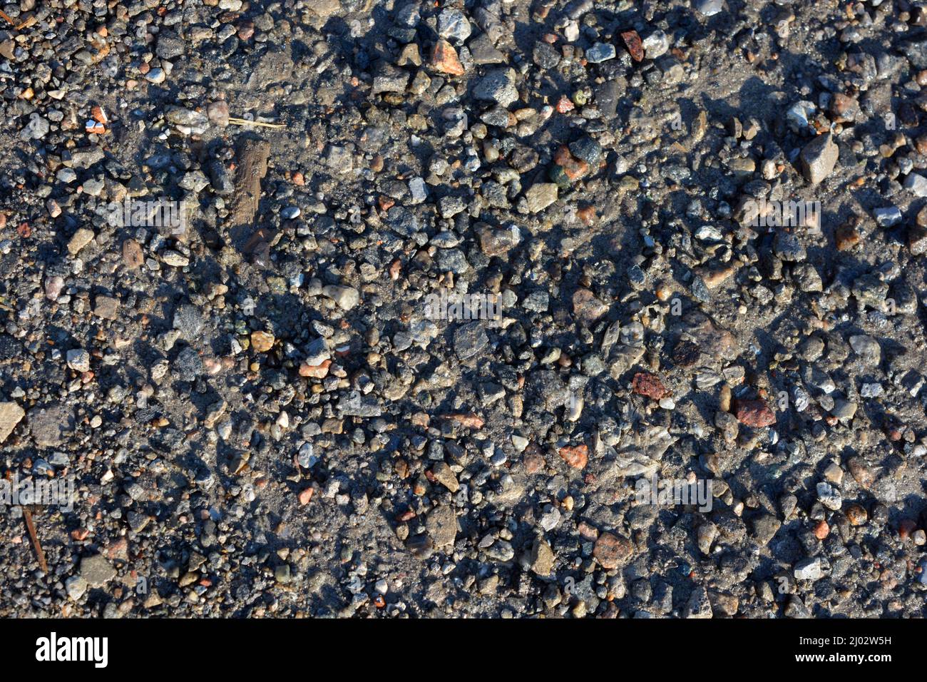 Nature, minerals, granite, gray stones and crumbs, red small bricks ...