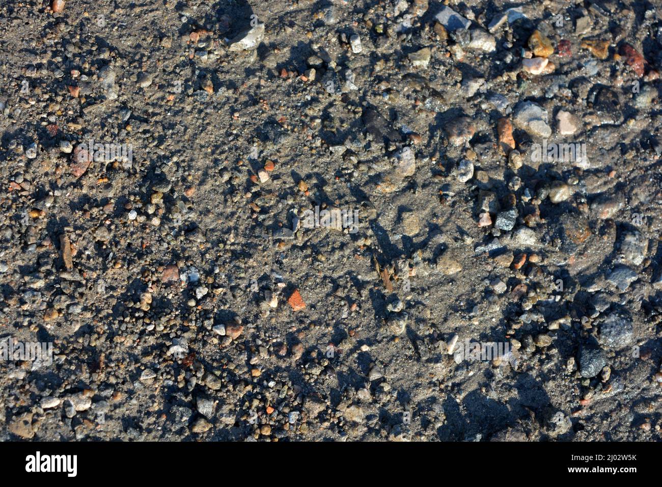 Nature, minerals, granite, gray stones and crumbs, red small bricks ...