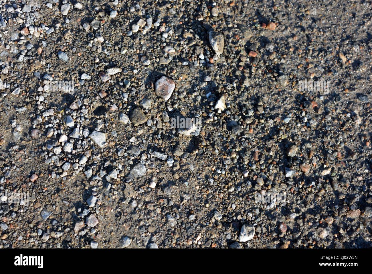 Nature, minerals, granite, gray stones and crumbs, red small bricks ...