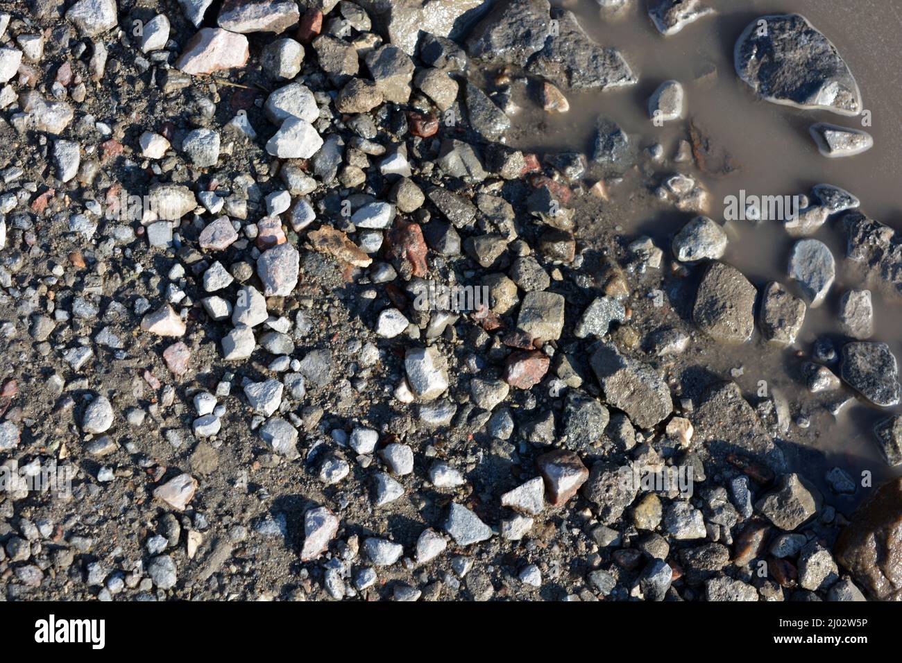 Nature, minerals, granite, gray stones and crumbs, red small bricks ...