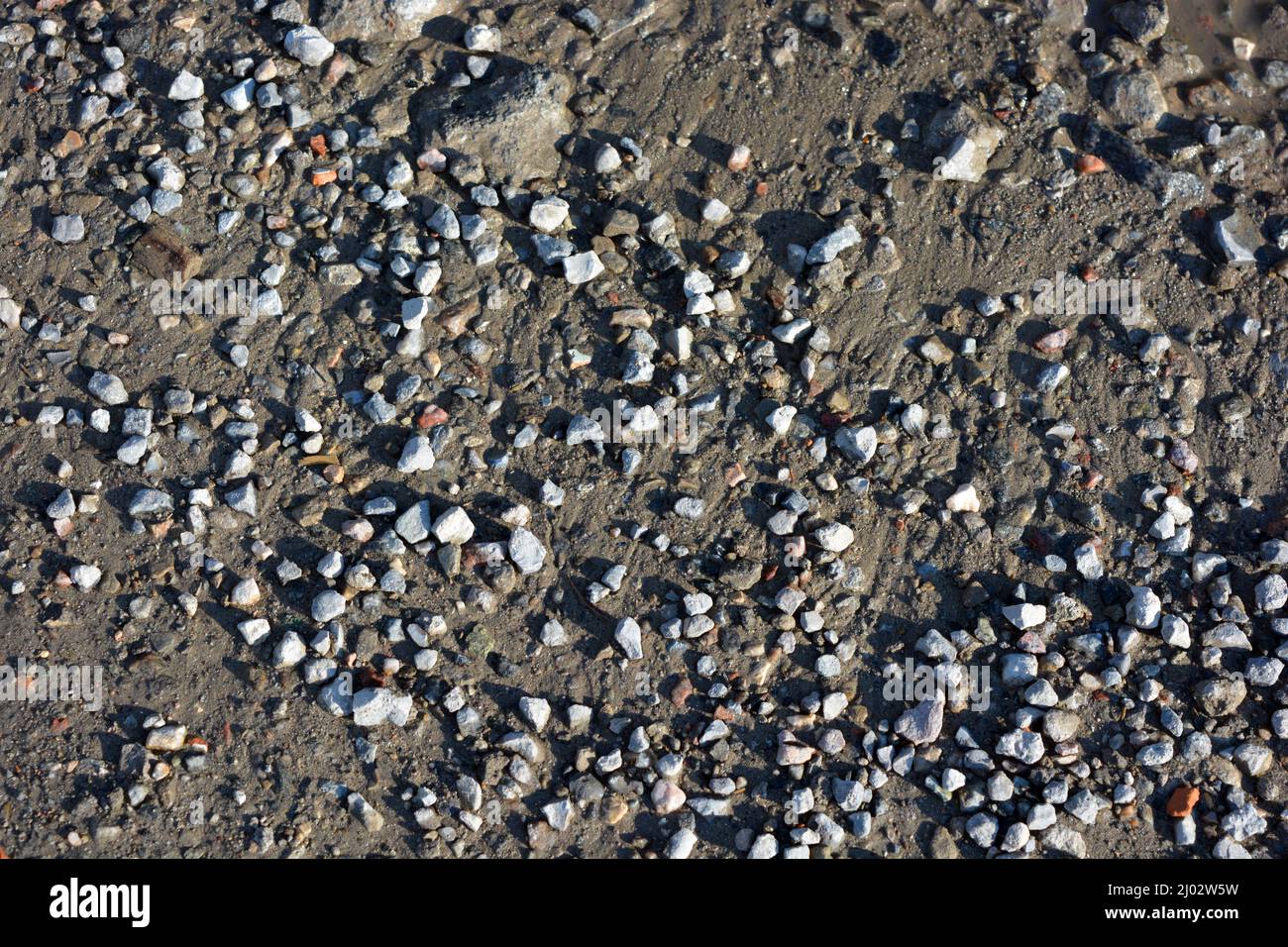 Nature, minerals, granite, gray stones and crumbs, red small bricks ...