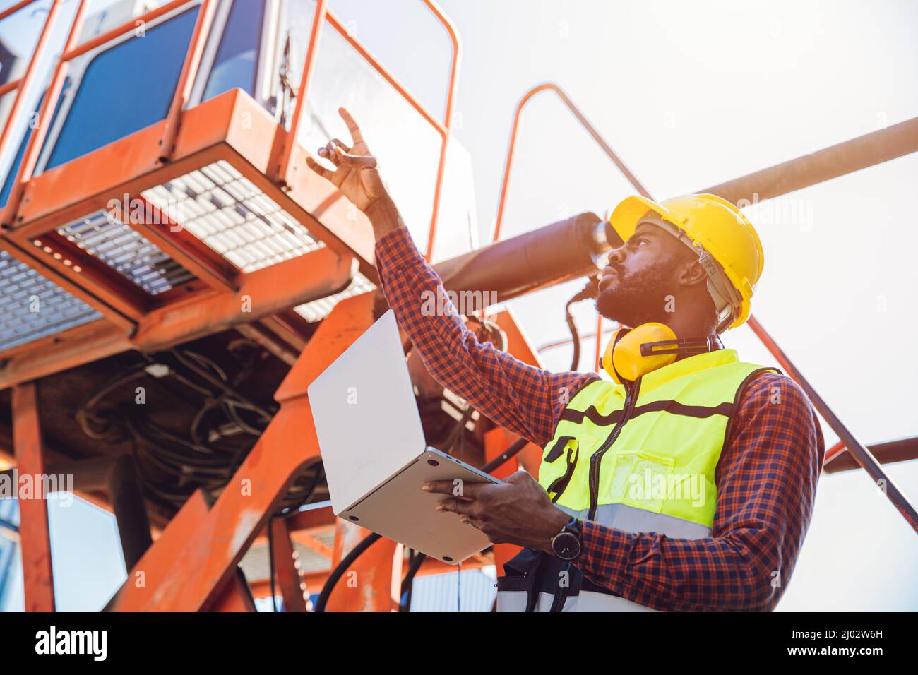 Portrait Black African staff worker happy smile working in cargo crane ...
