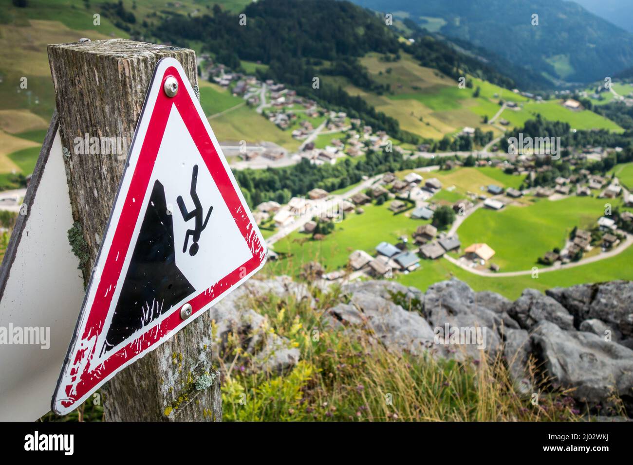 Fall danger warning sign near a high cliff Stock Photo - Alamy