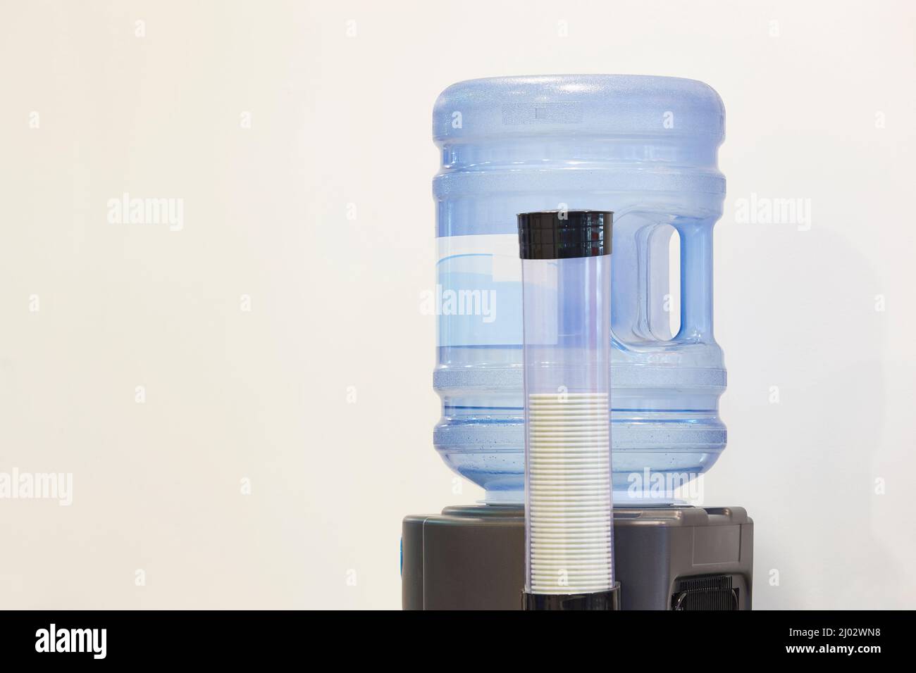 Plastic bottle pure water dispenser machine over a white background ...