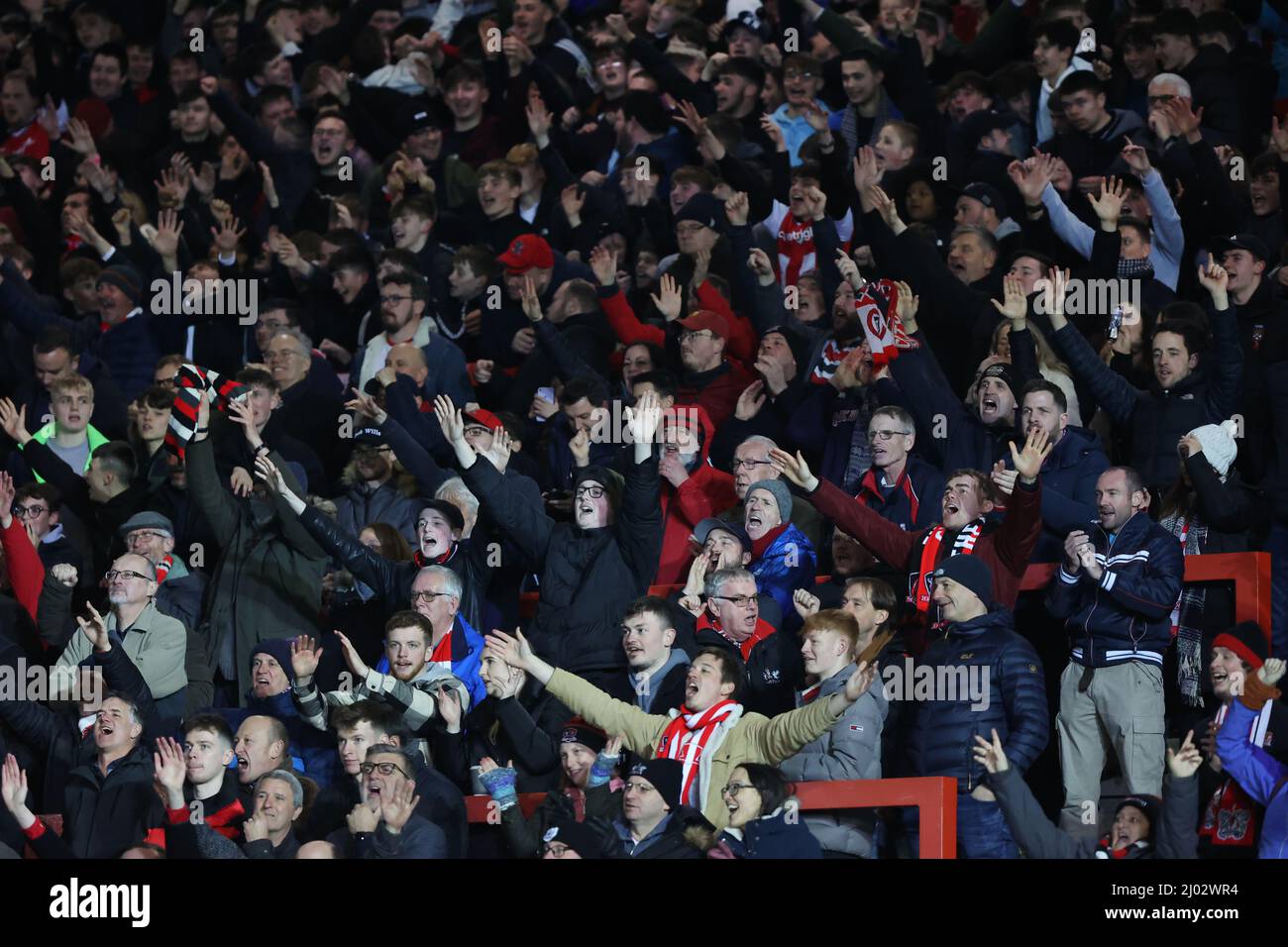 Fans standing on the terraces of the Big Bank at St James Park home of ...