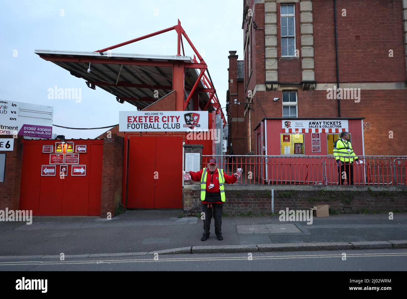 Programme seller outside St James Park home of Exeter City before their ...
