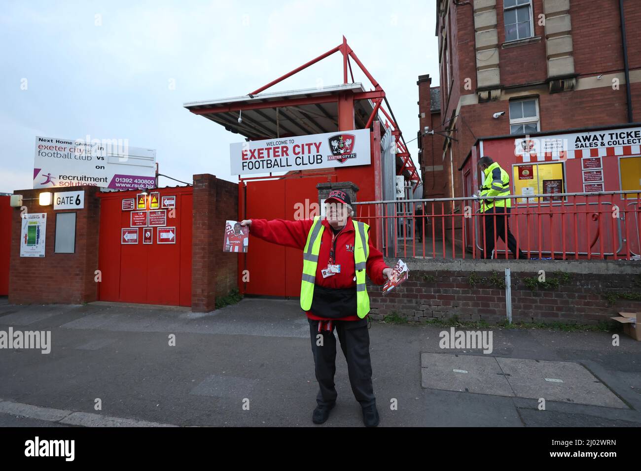 Programme seller outside St James Park home of Exeter City before their ...