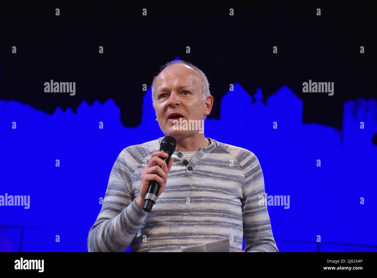 Cologne, Germany. 15th Mar, 2022. The playwright Rolf Sperling on stage ...