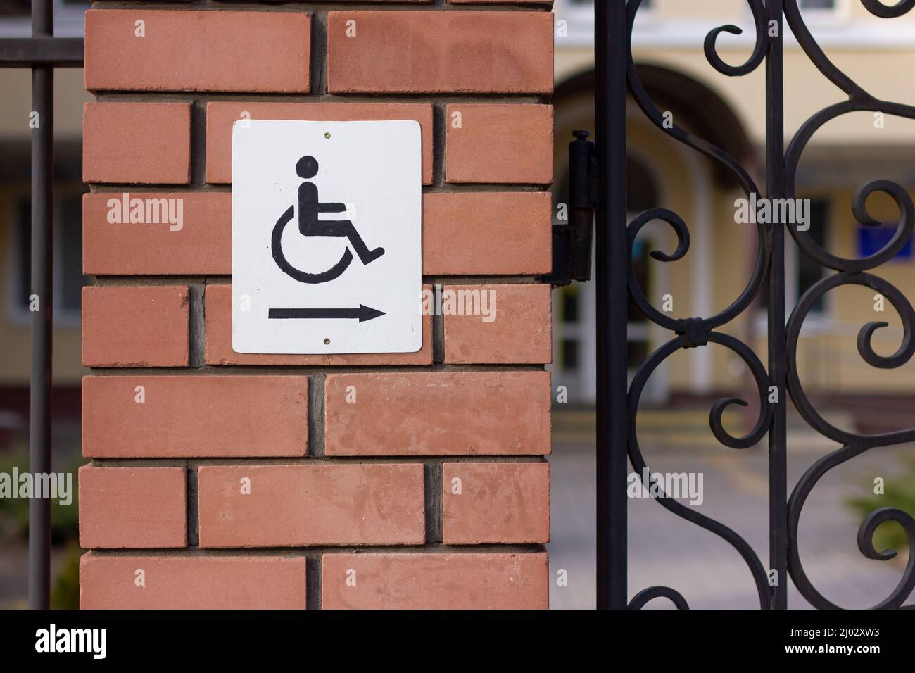 Handicapped sign brick wall hi-res stock photography and images - Alamy