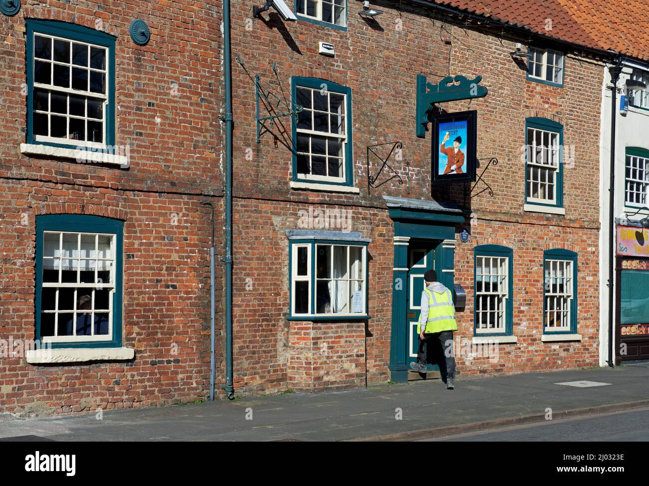 Man walking into the Yarborough Hunt pub in Brigg, North Lincolnshire ...