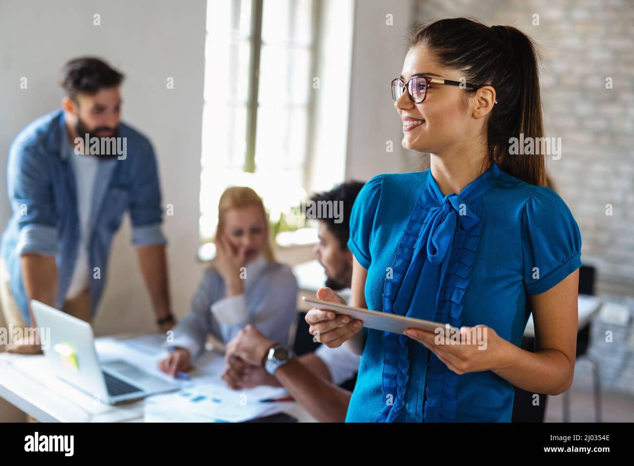 Group of success people working together at corporate workplace ...