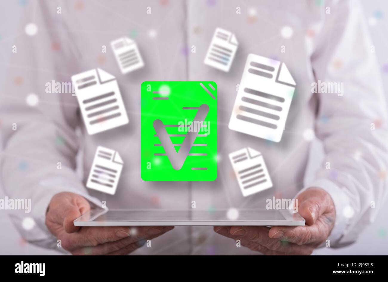 Document validation concept above a tablet held by a man in background ...