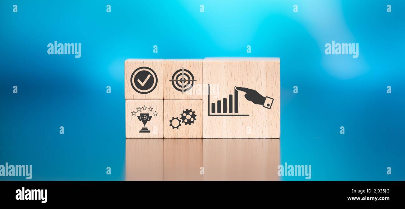 Wooden blocks with symbol of goals concept on blue background Stock ...