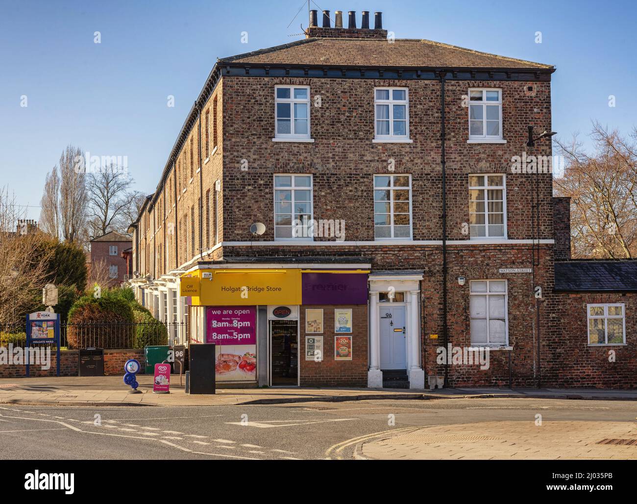 A typical corner shop at the end of a row of terraced houses. A road ...