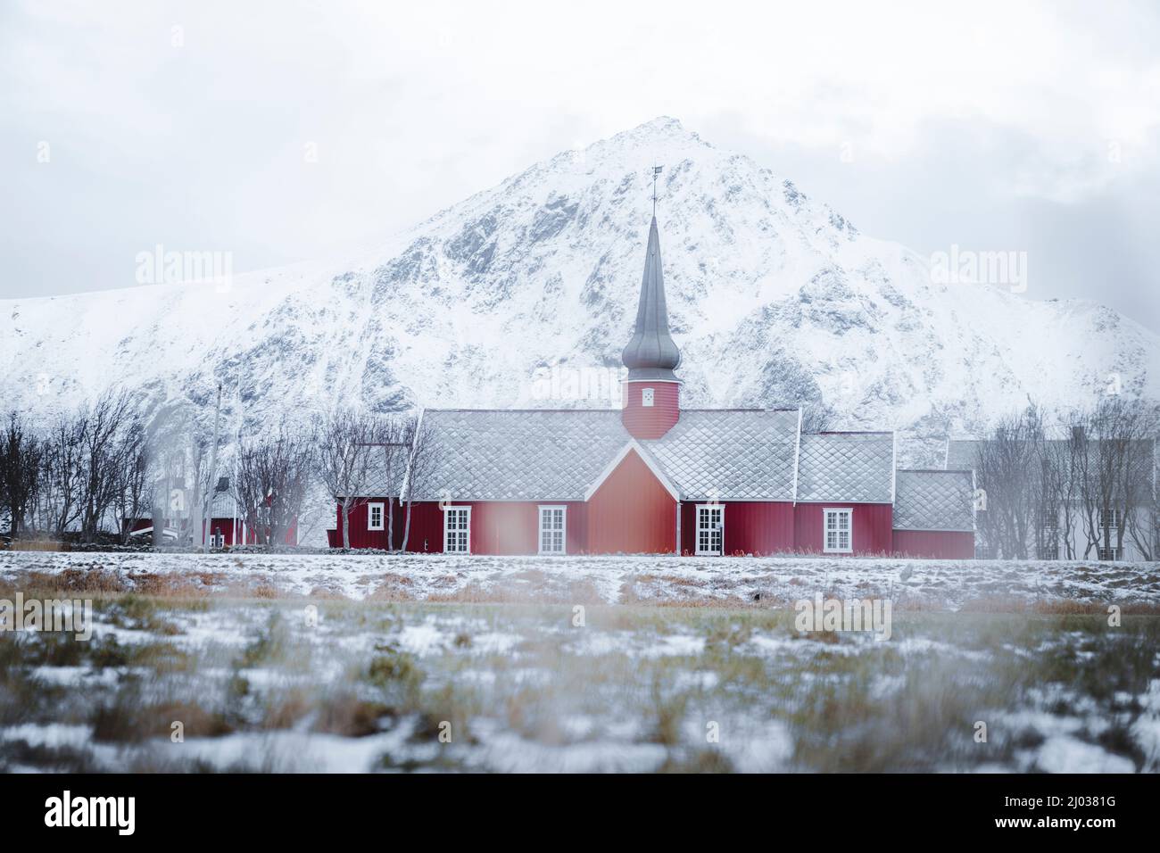Red church of Flakstad in winter fog, Flakstad, Nordland county ...