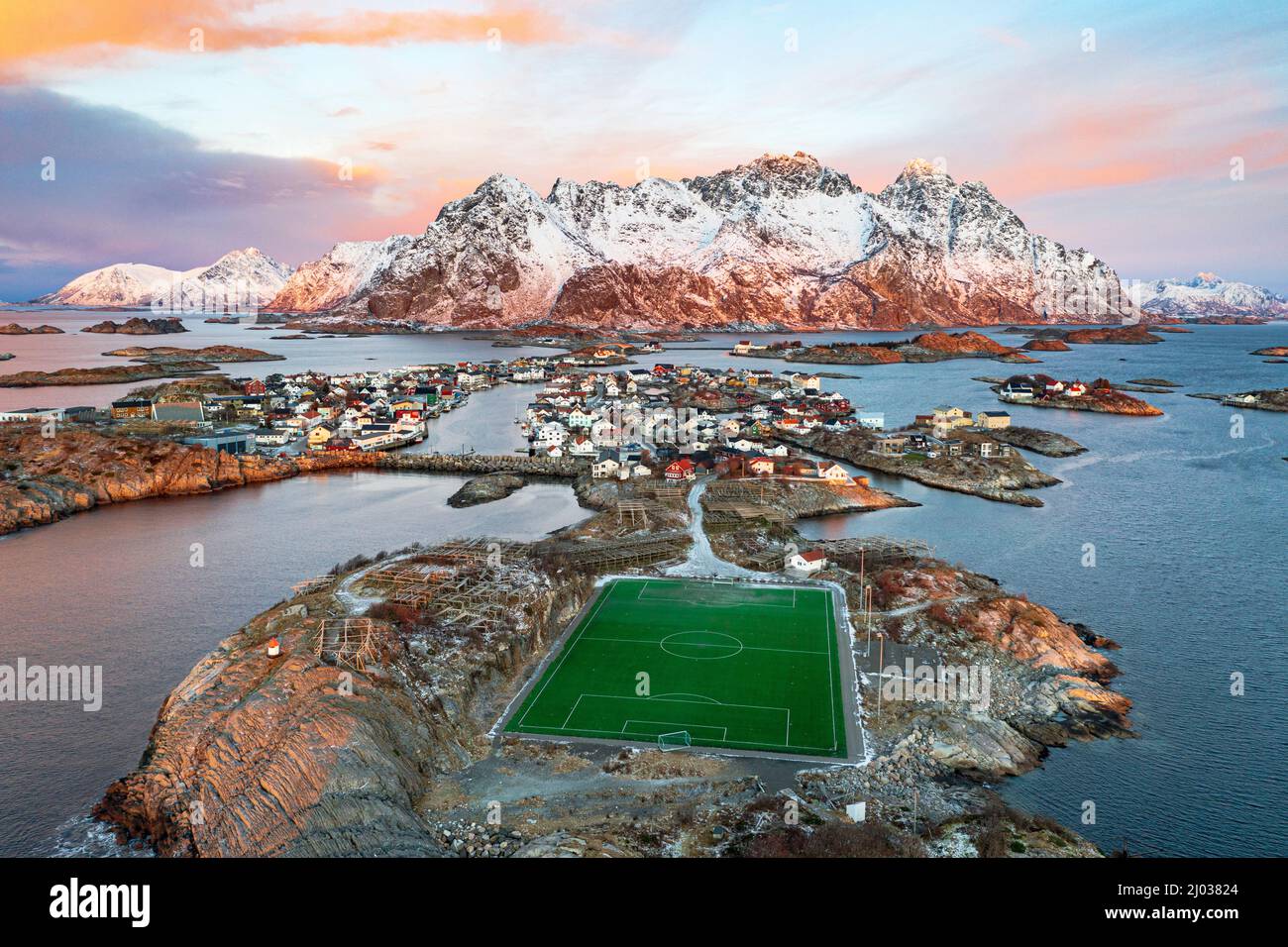 Aerial view of soccer stadium and Henningsvaer village during winter ...