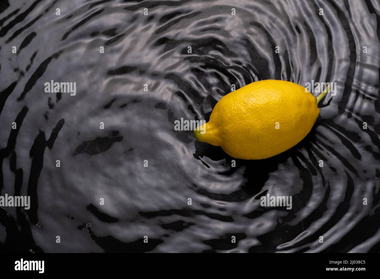lemon in the water with waves Stock Photo - Alamy