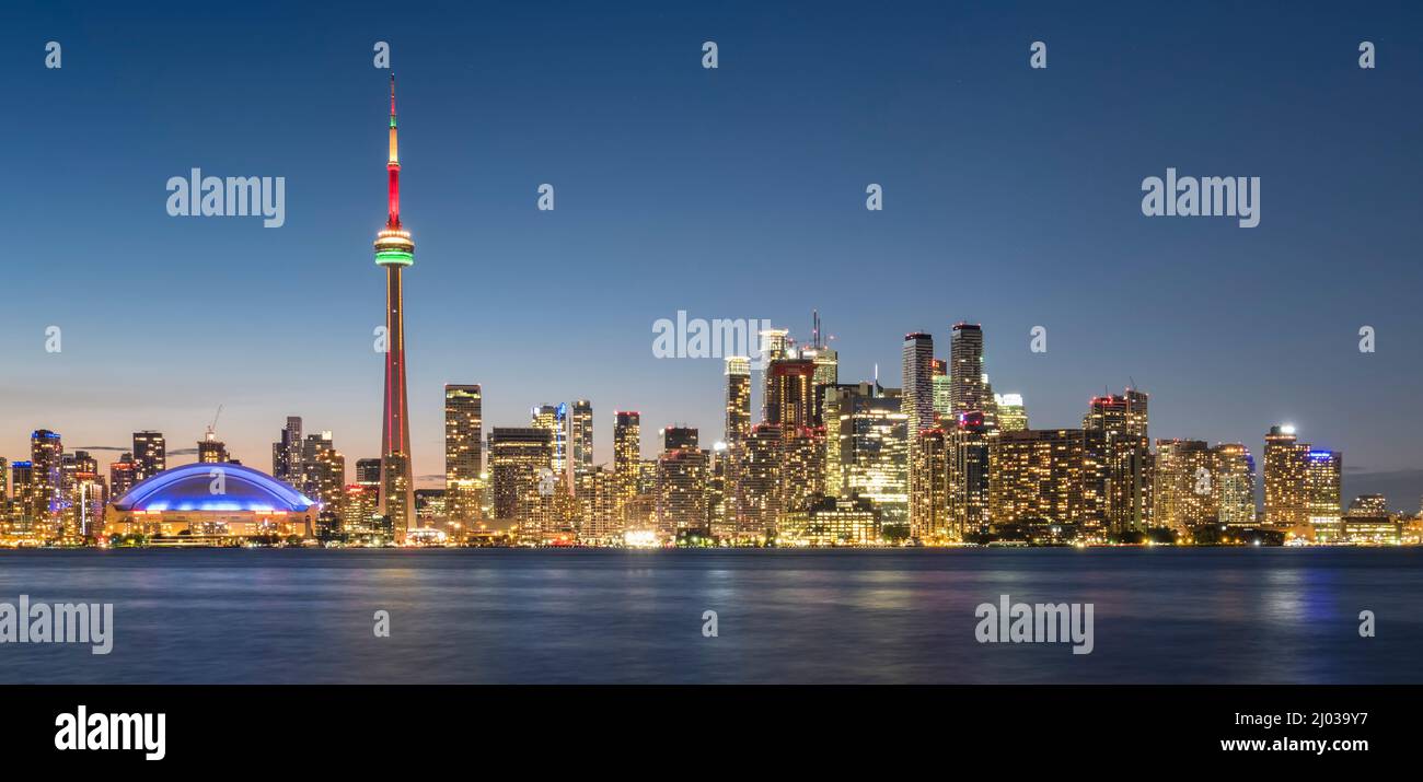 Toronto skyline featuring the CN Tower at night across Lake Ontario ...