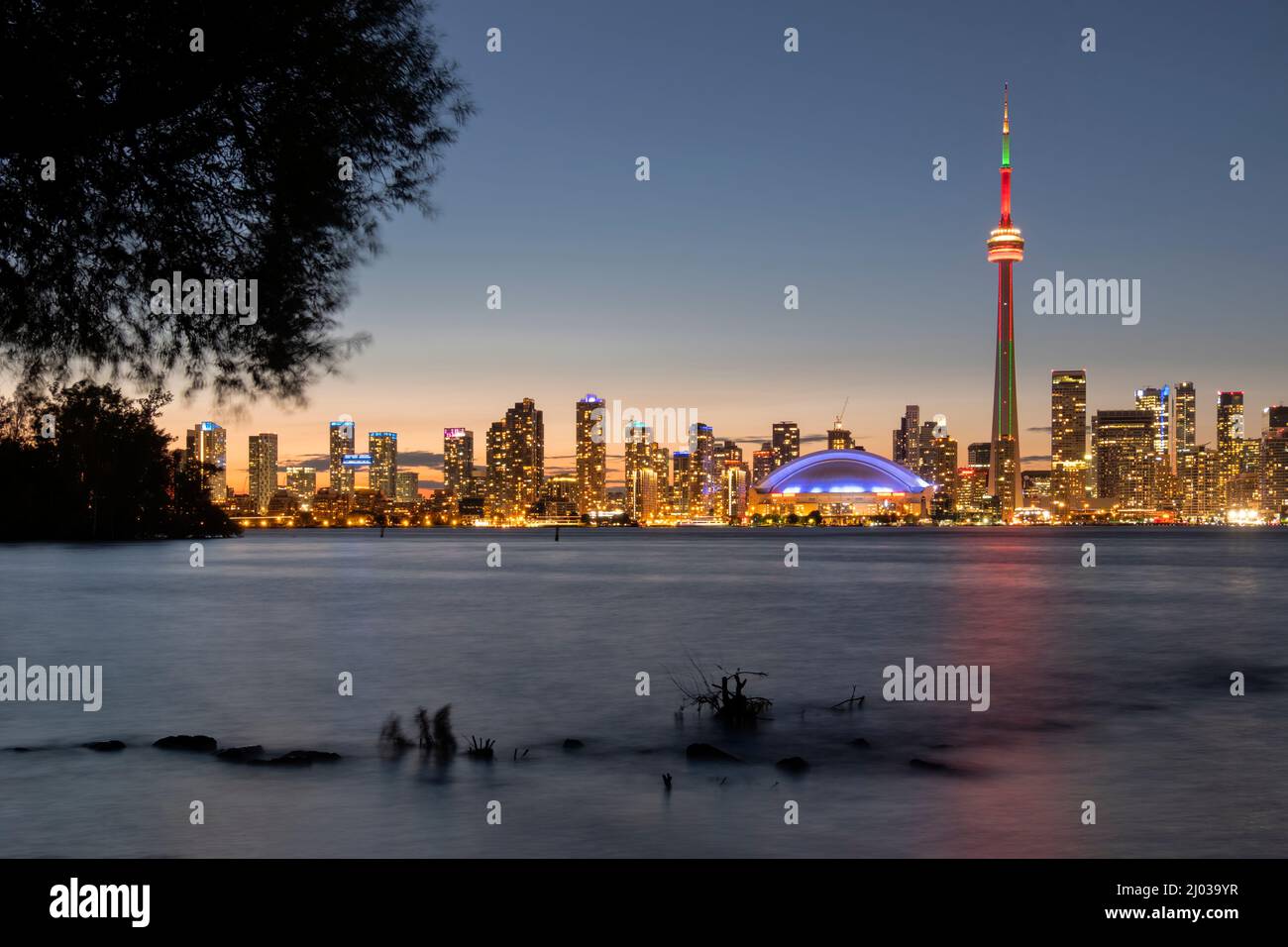 Toronto skyline featuring the CN Tower at night across Lake Ontario ...