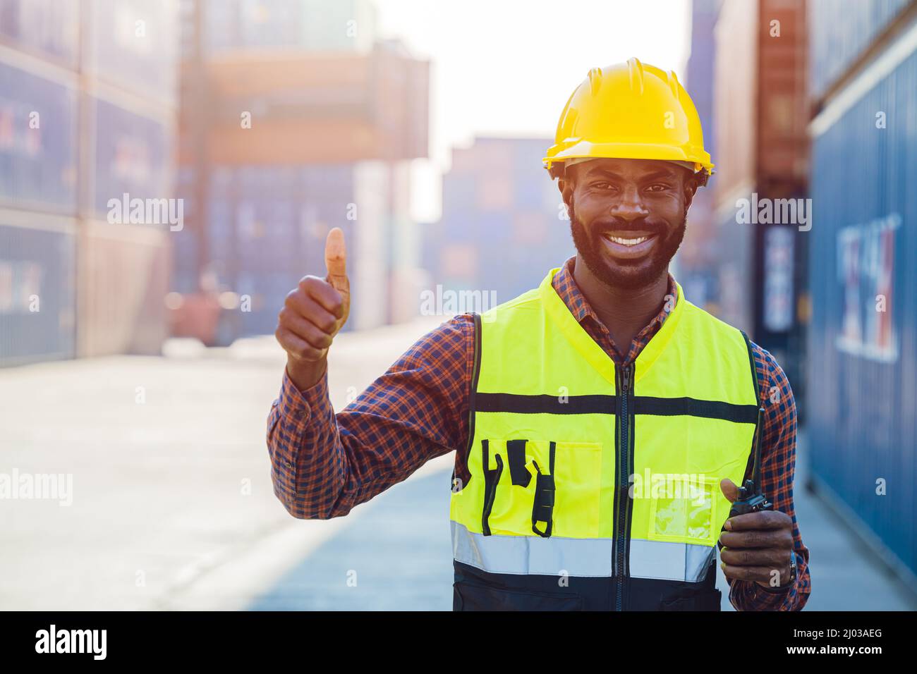 Portrait Black African staff worker happy smile working in cargo crane ...