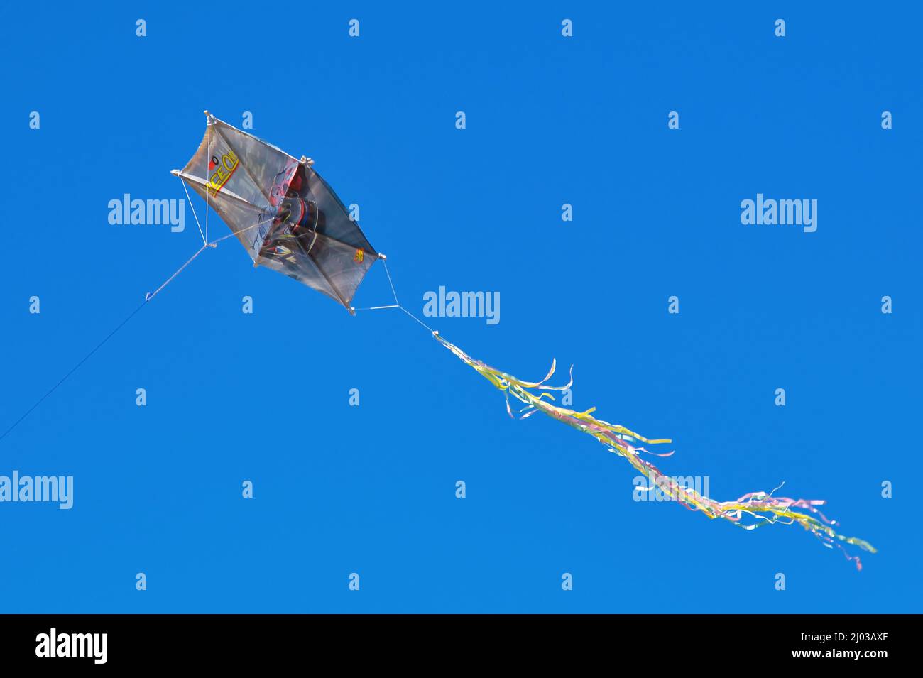 colorful kites in blue sky with small white clouds Stock Photo - Alamy