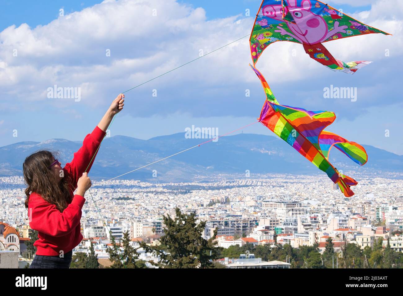 colorful kites in blue sky with small white clouds Stock Photo - Alamy